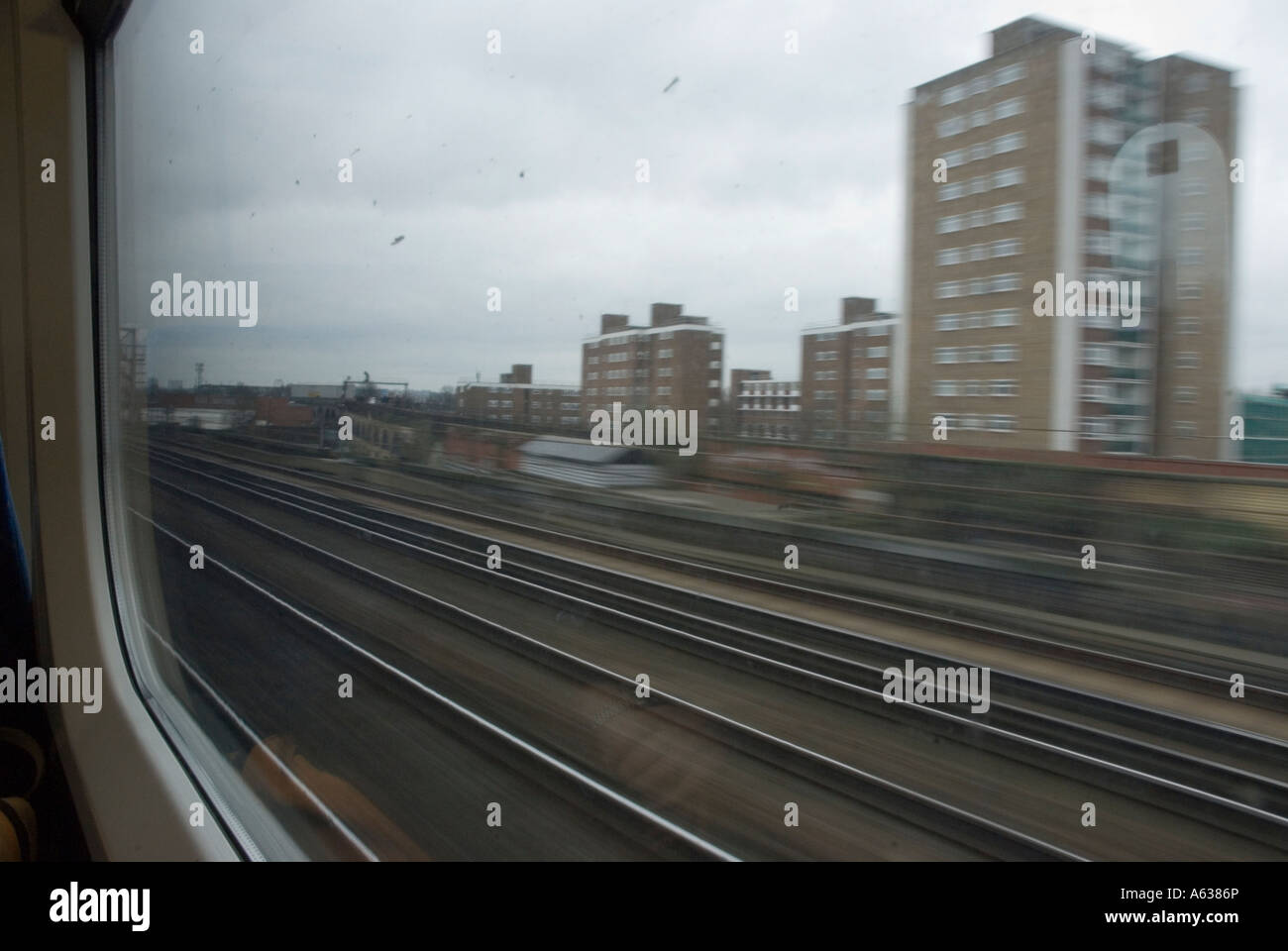 Train travelling through the urban landscape hi-res stock photography ...