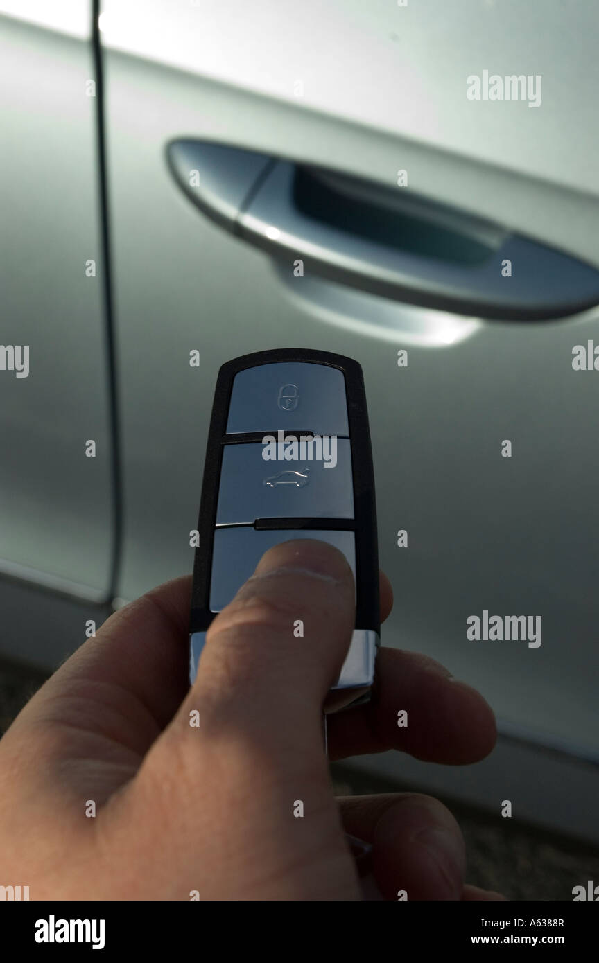 Mans hand holding the electronic key fob of a new car Stock Photo - Alamy