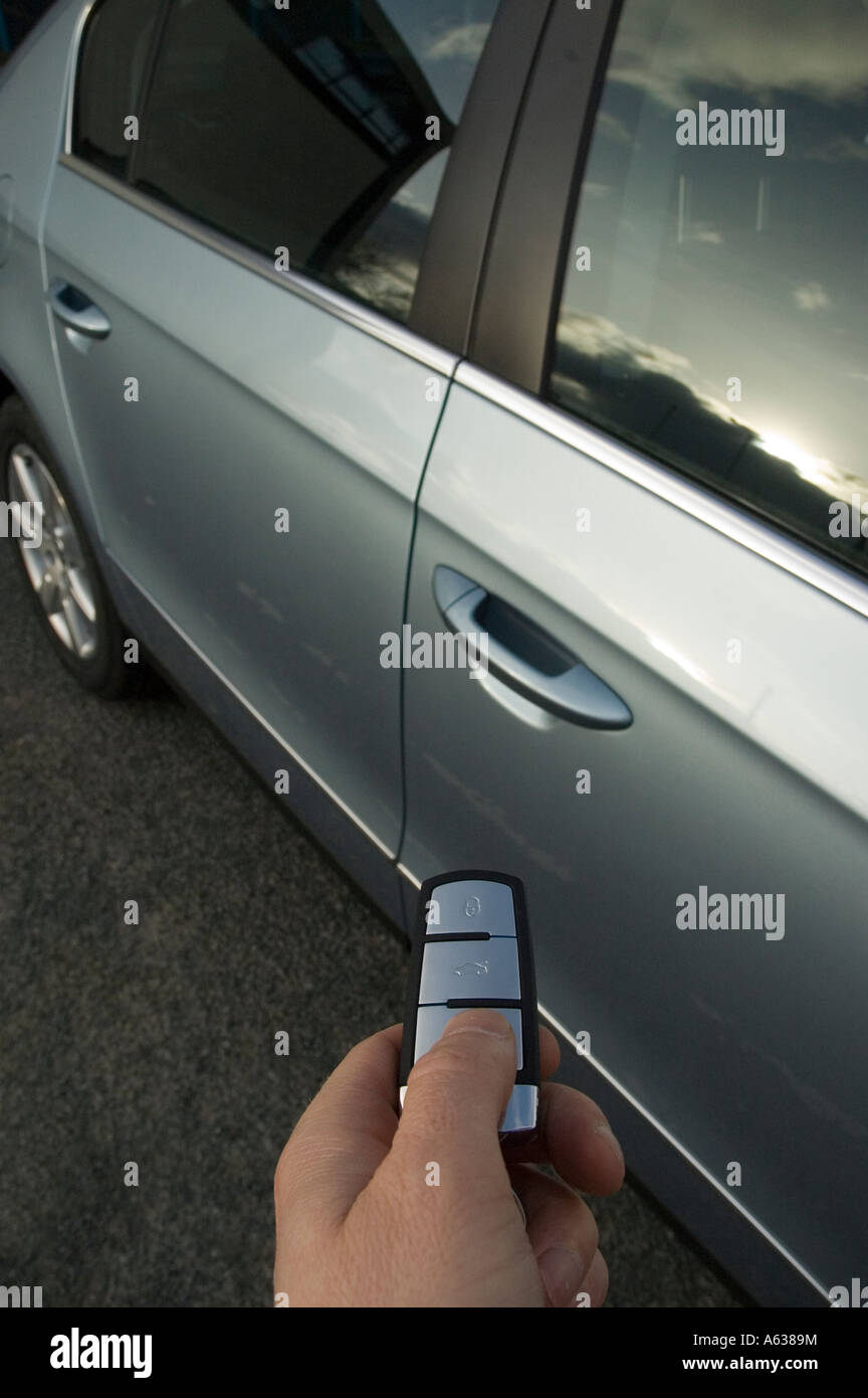 Mans hand holding the electronic key fob of a new car Stock Photo - Alamy