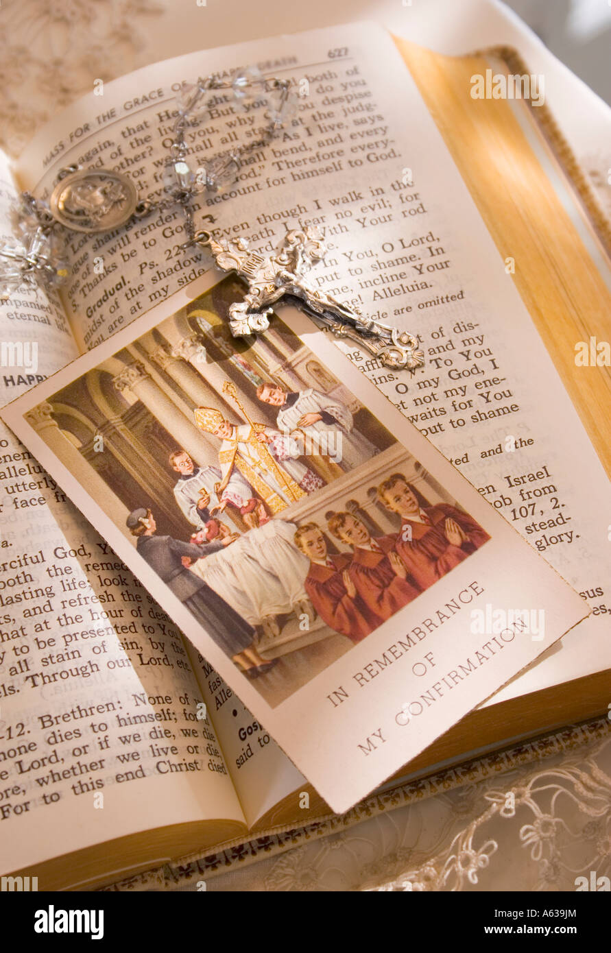 Catholic Confirmation: holy card with rosary, on an open missal Stock ...