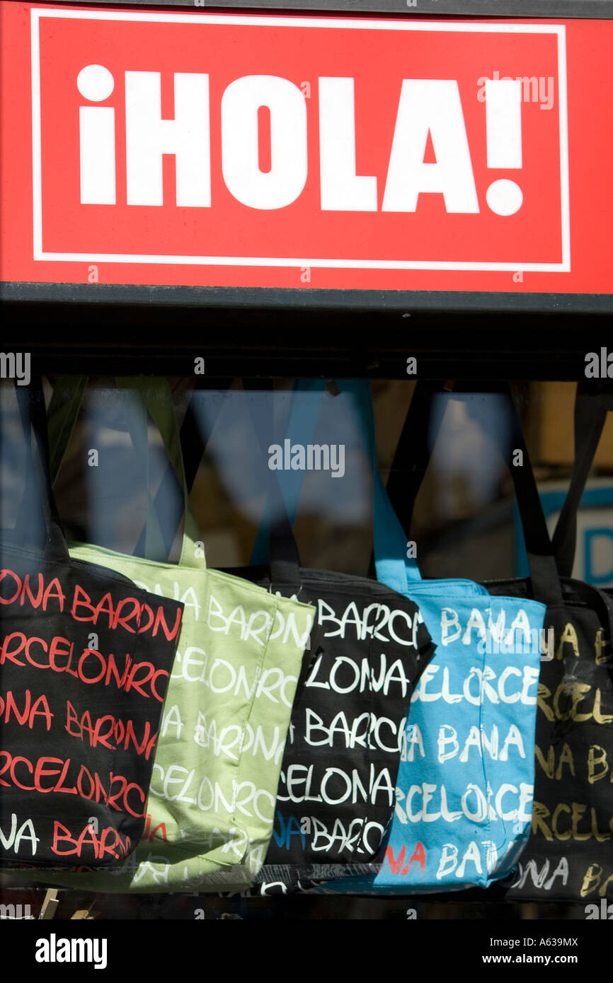 Hola sign and Barcelona souvenir bags for sale in kiosk window, La ...