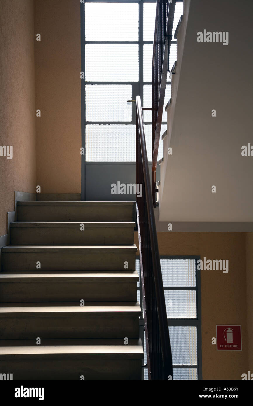 narrow stairs with handrail in a building Stock Photo - Alamy