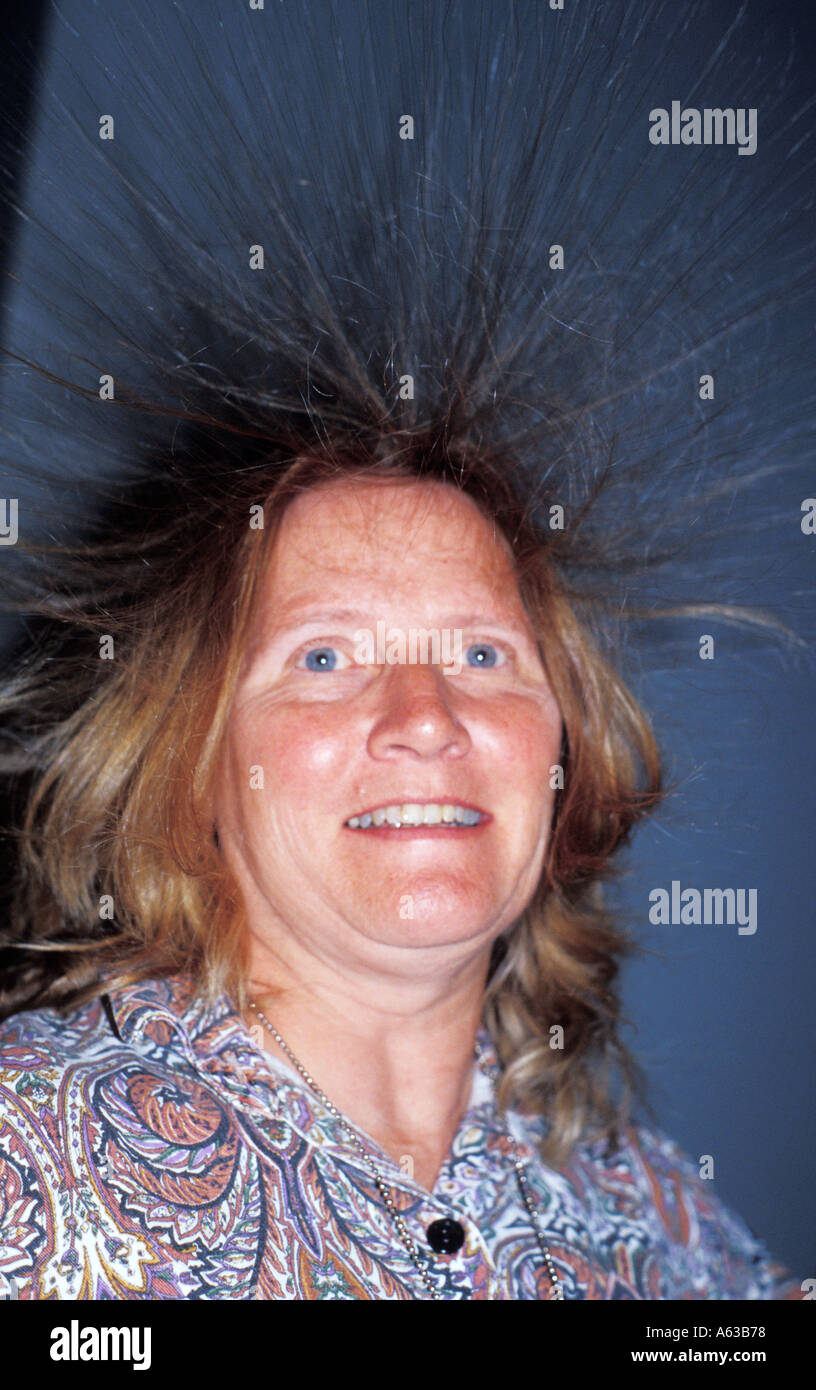 Tourist showing the effects of the Static Electricity Machine during a ...