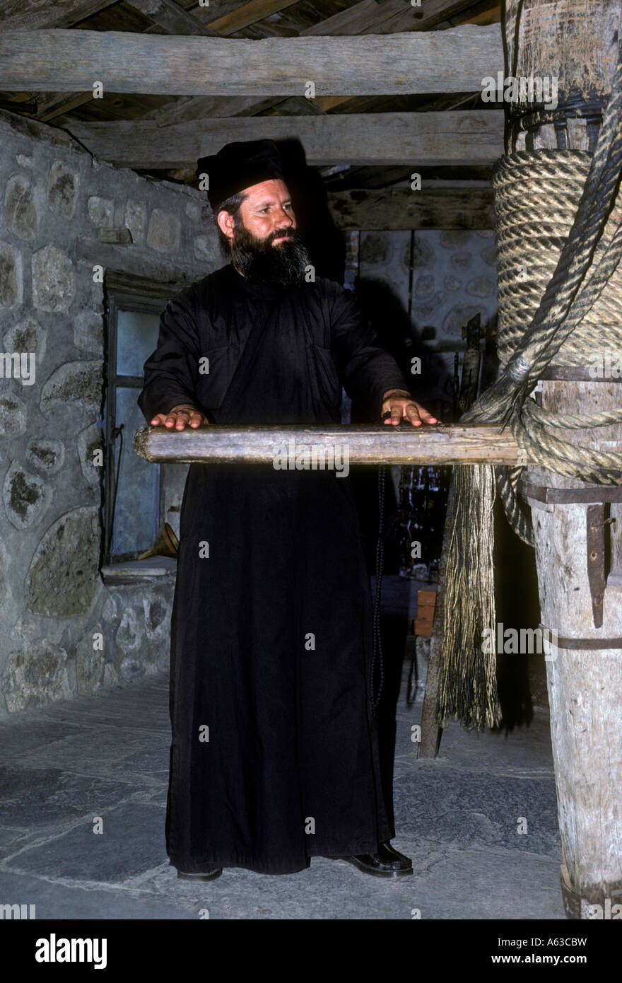 Greek monk operating windlass, Greek monk, windlass, Holy Monastery of ...
