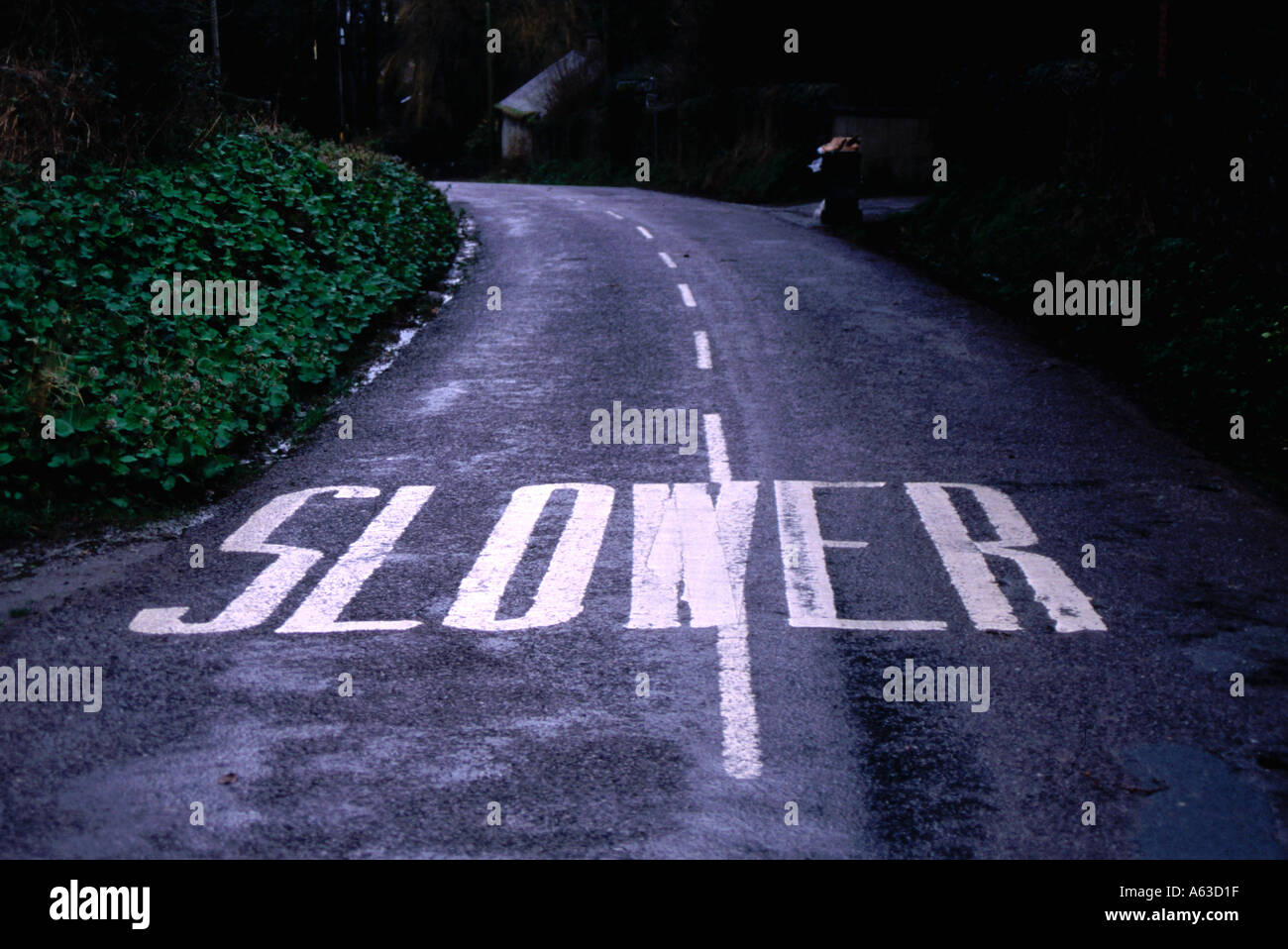 Slower Road Sign Stock Photo - Alamy