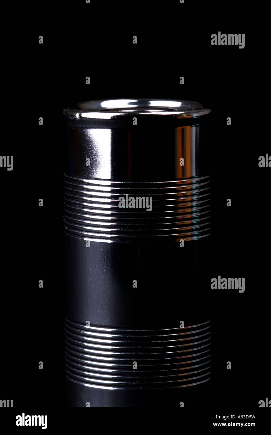 Silver can on black background Stock Photo - Alamy