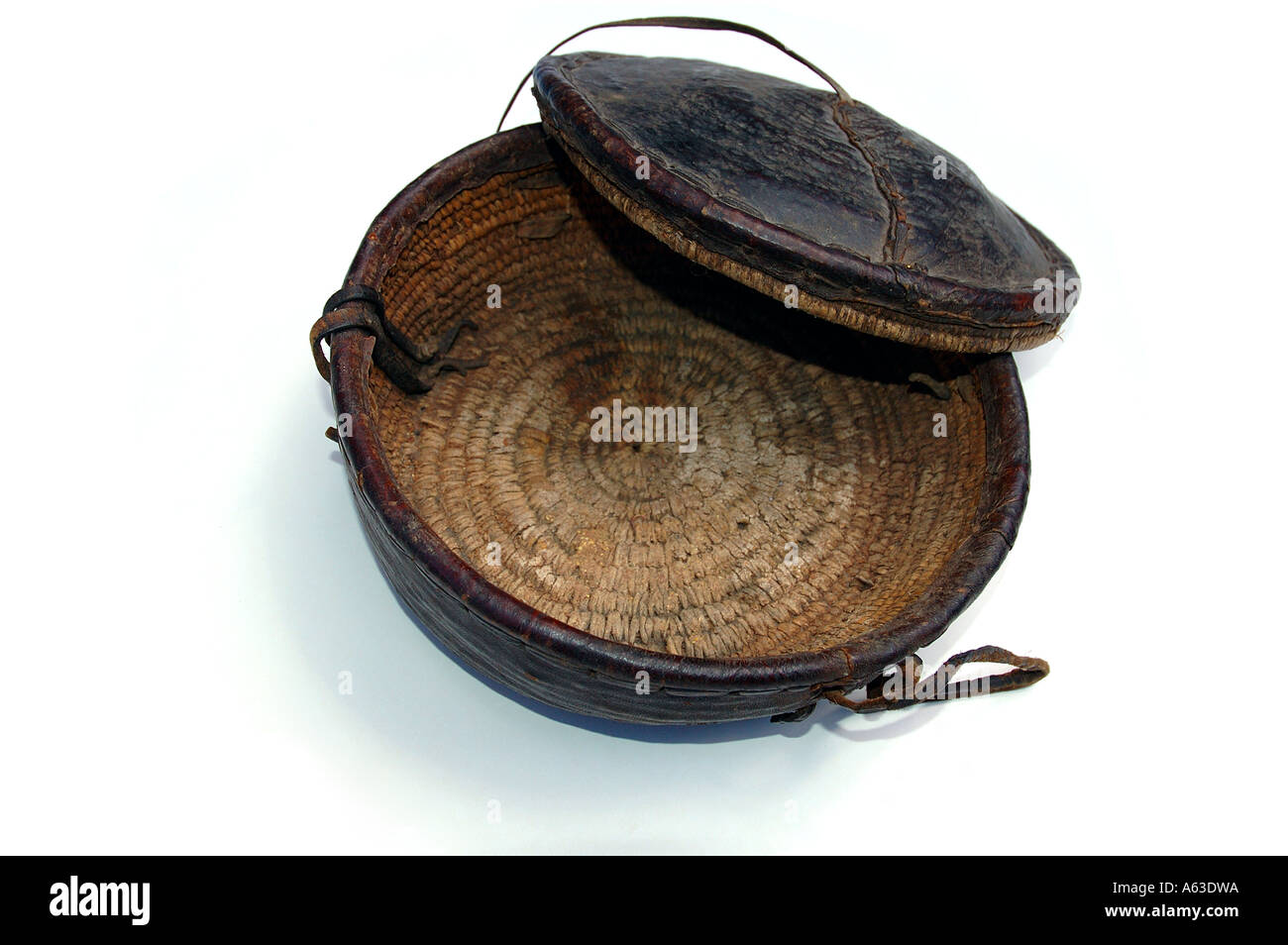 Antique handwoven reed and leather basket in traditional style used for ...