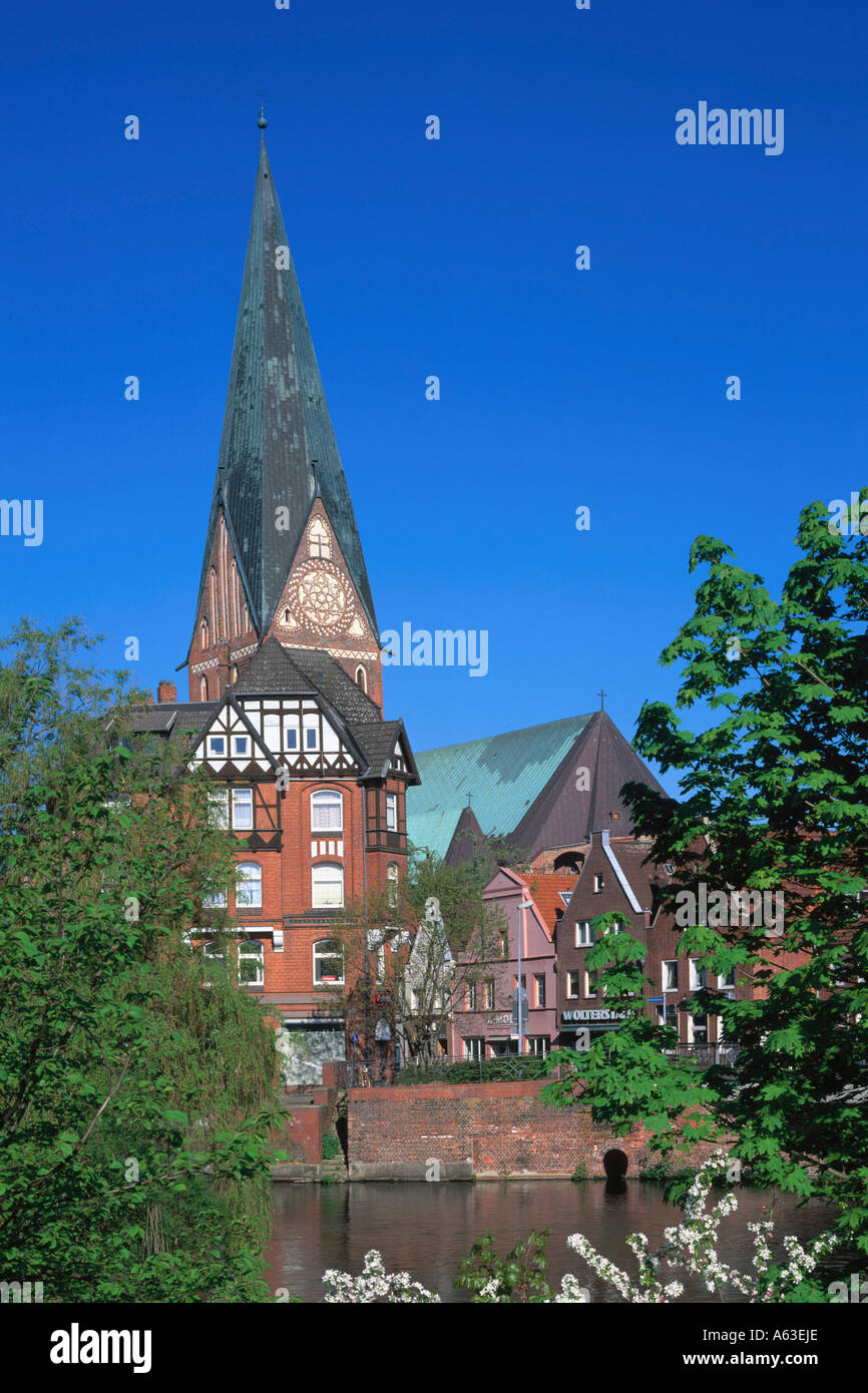 Church spire against blue sky, St. John's Church, Lunenburg, Germany ...