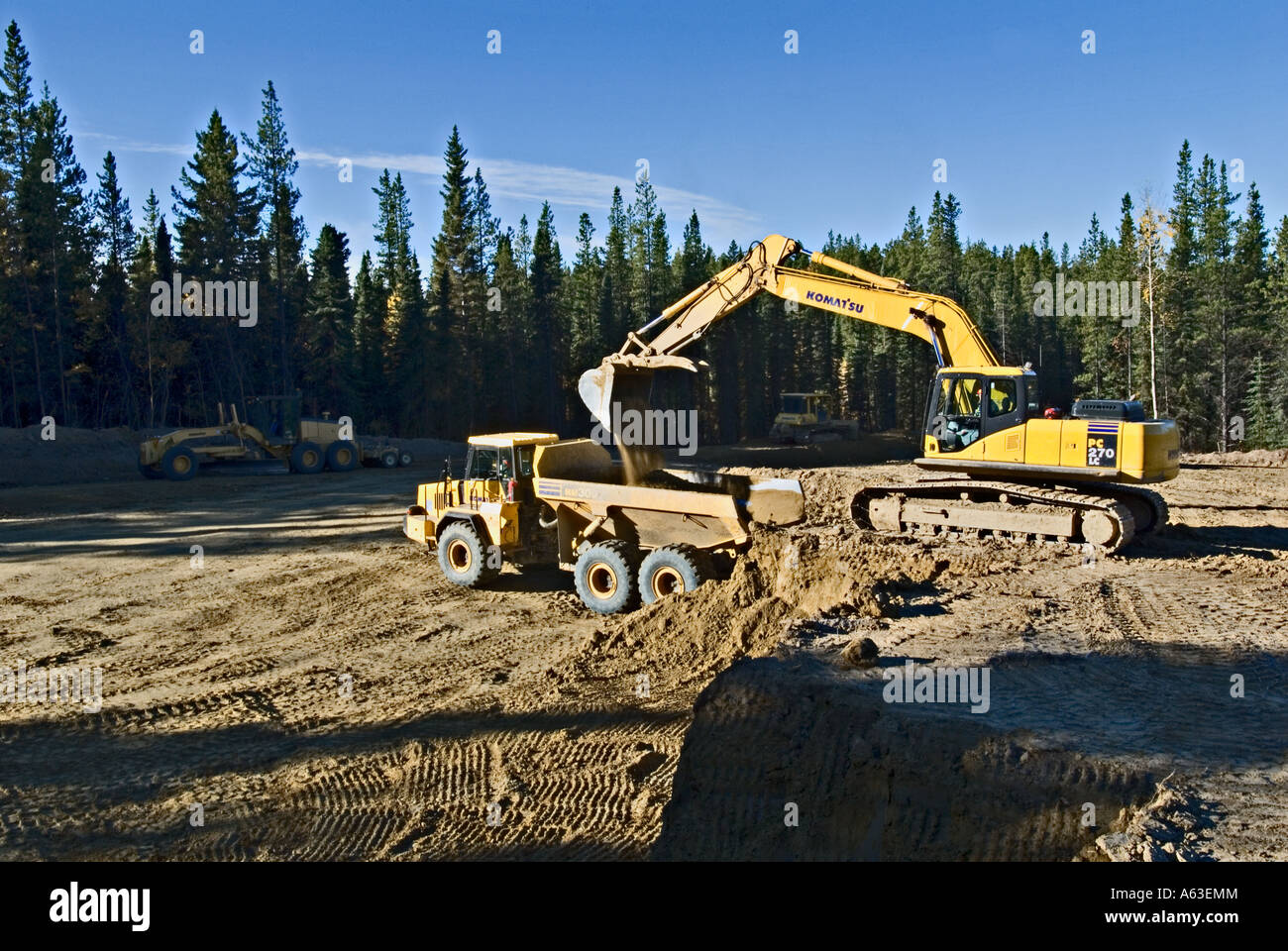 Excavator loading truck hi-res stock photography and images - Alamy