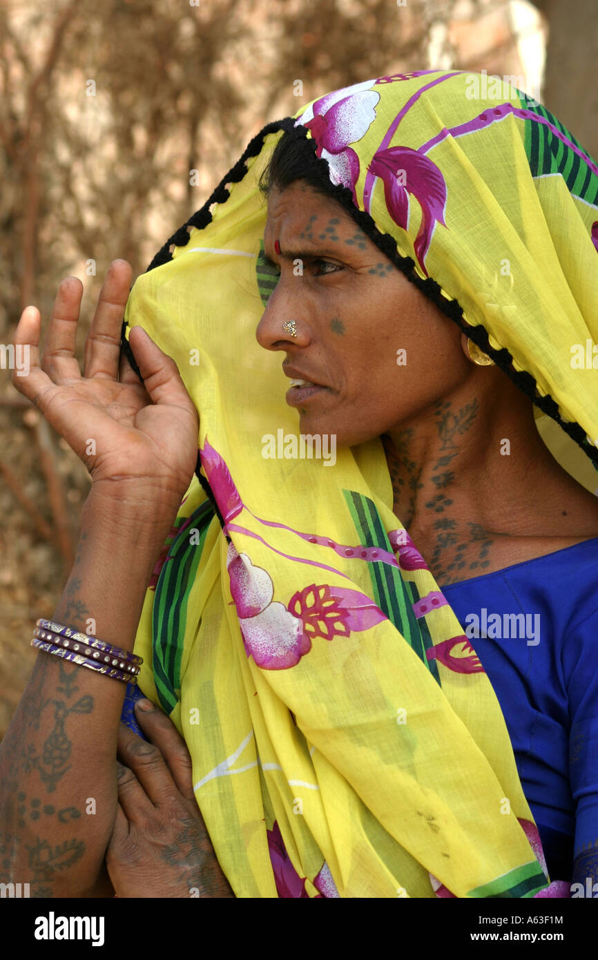Vibrantly colourful tattoed woman of the Bharwad tribe at Ambala ...