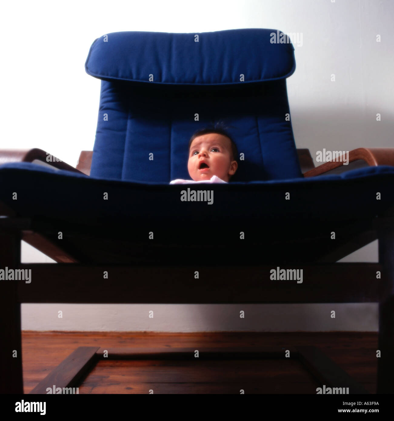 baby screaming in a rocking chair Stock Photo - Alamy