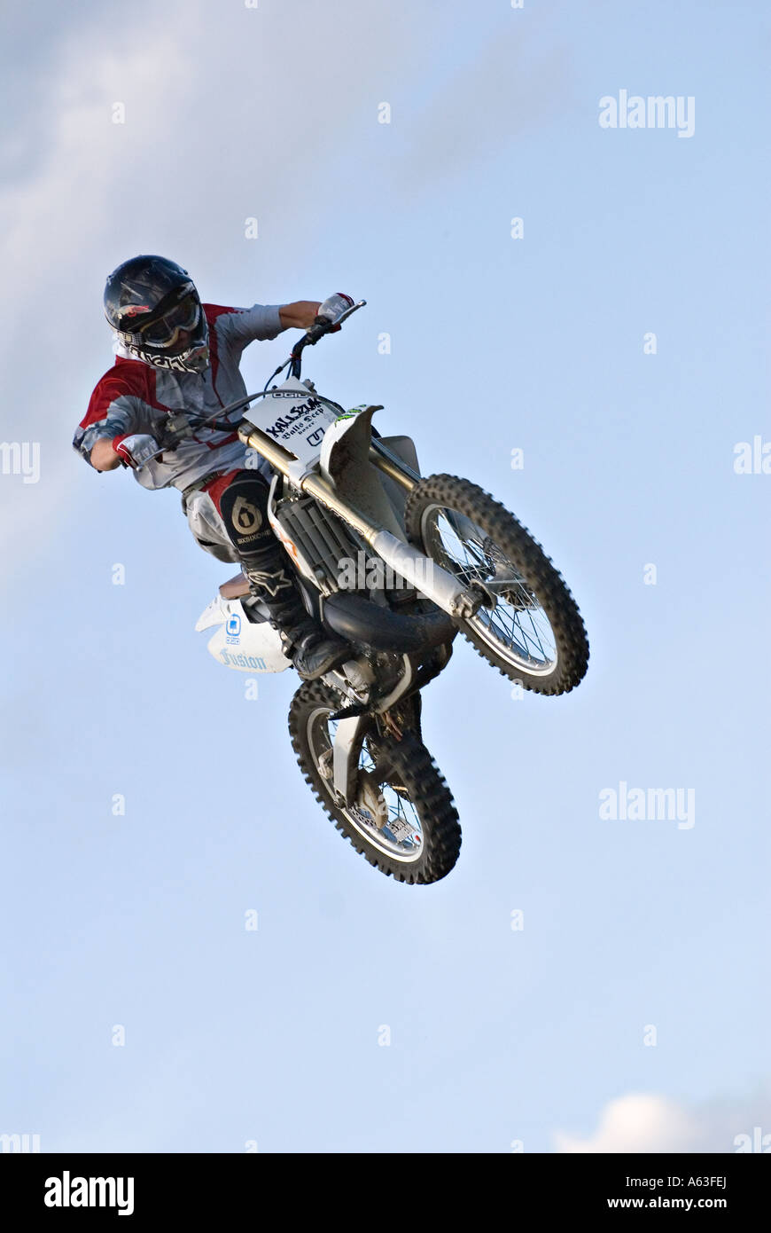 A Motocross rider performing a stunt Stock Photo - Alamy