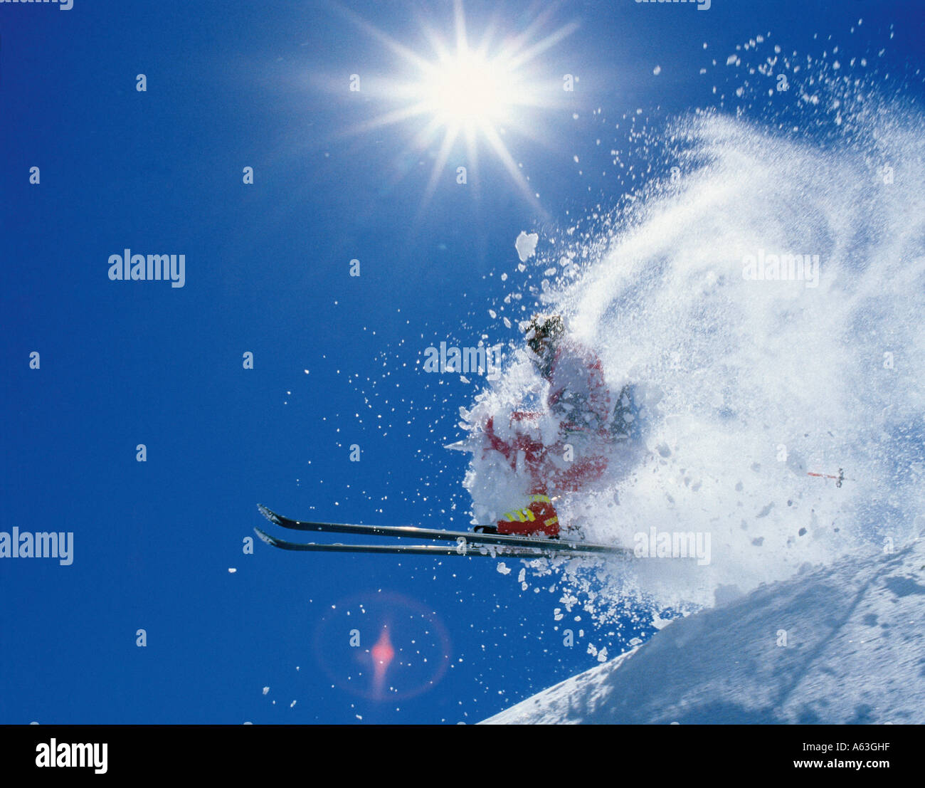 Low angle view of a person skiing against clear blue sky Stock Photo ...