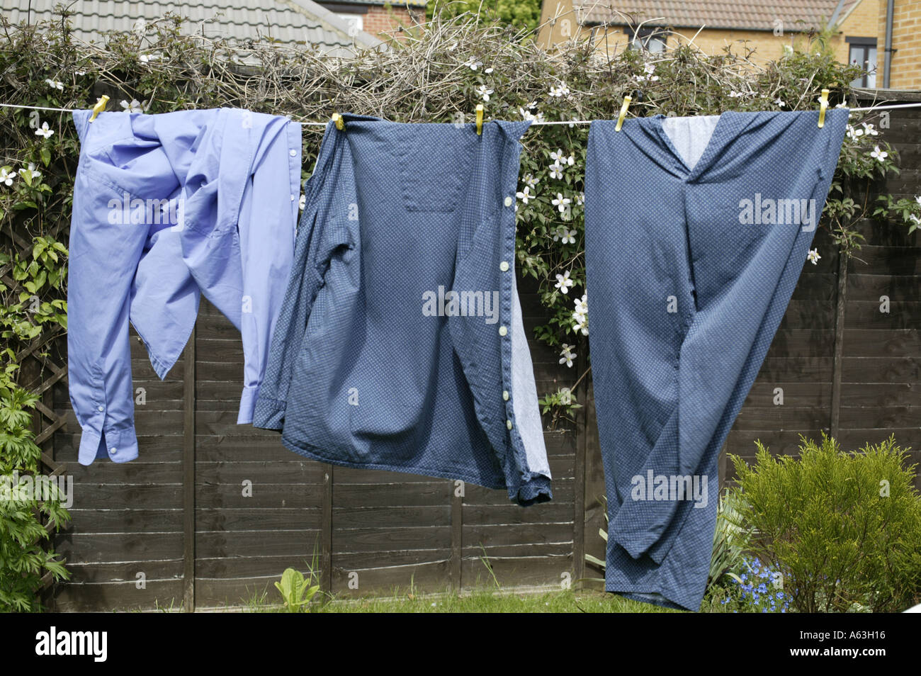 shirts drying on washing line Stock Photo - Alamy