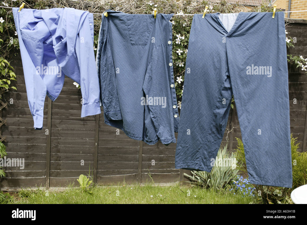 shirts drying on washing line Stock Photo - Alamy