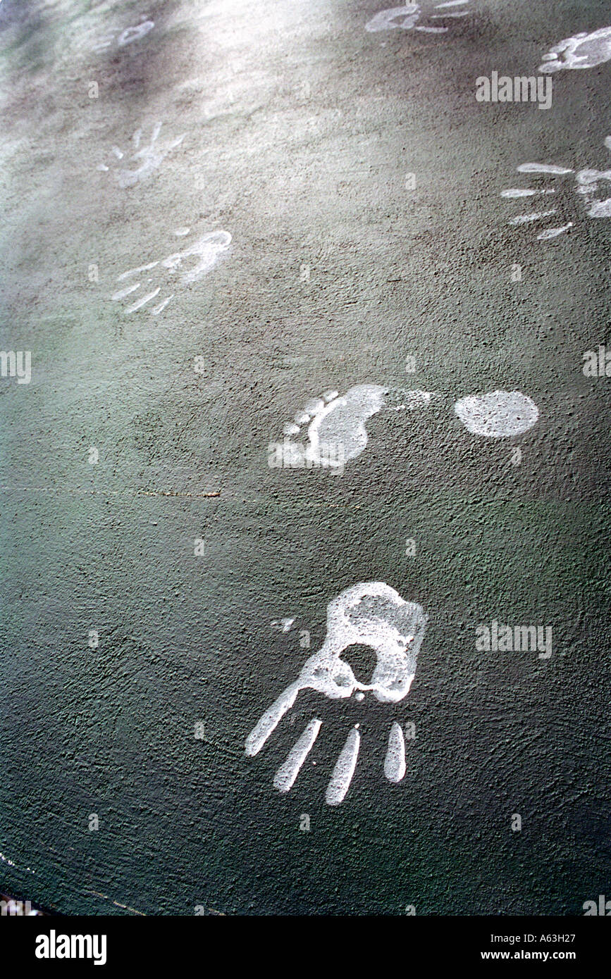 hands and feet painted on wall road Stock Photo - Alamy