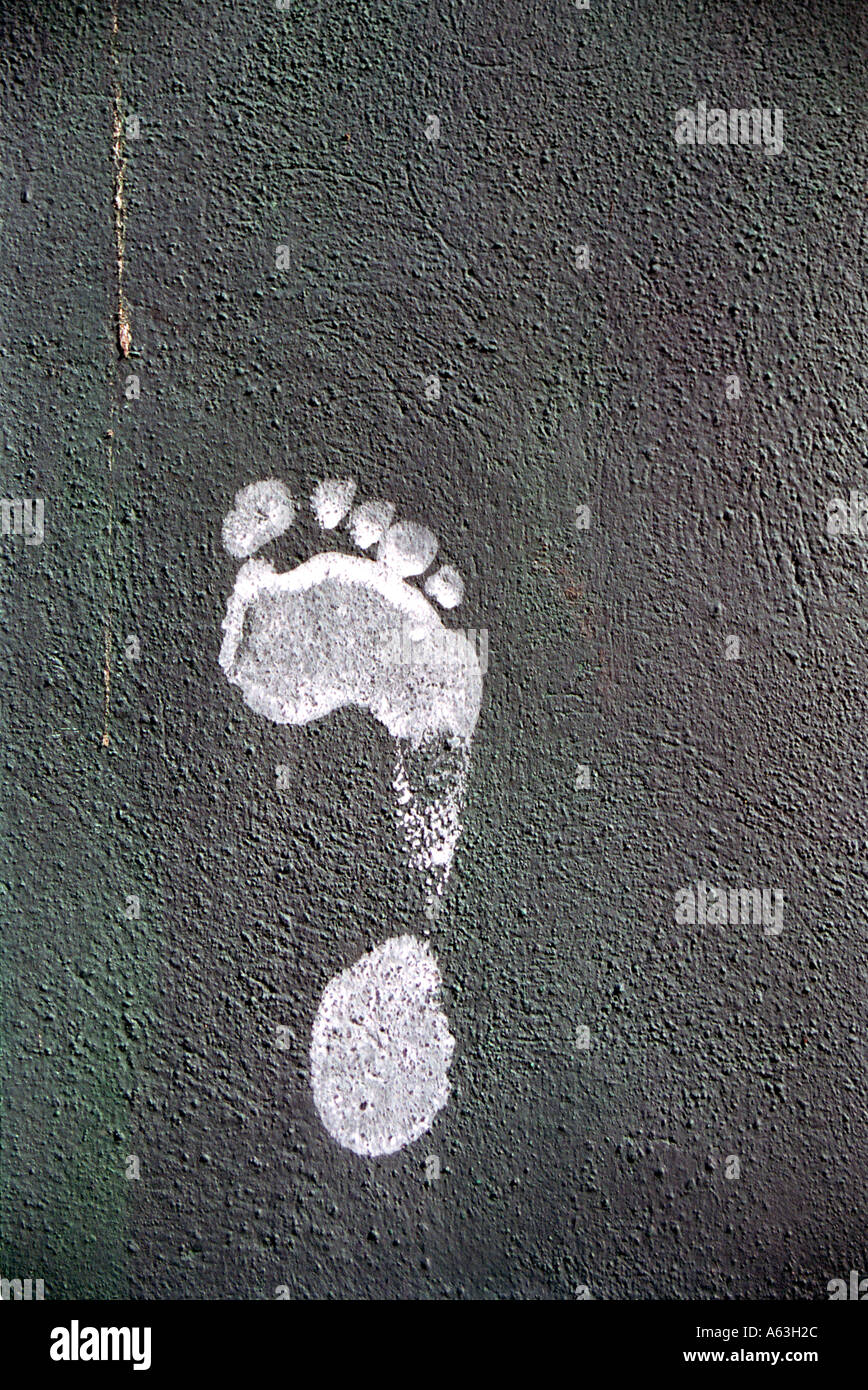 foot print painted on wall road Stock Photo - Alamy
