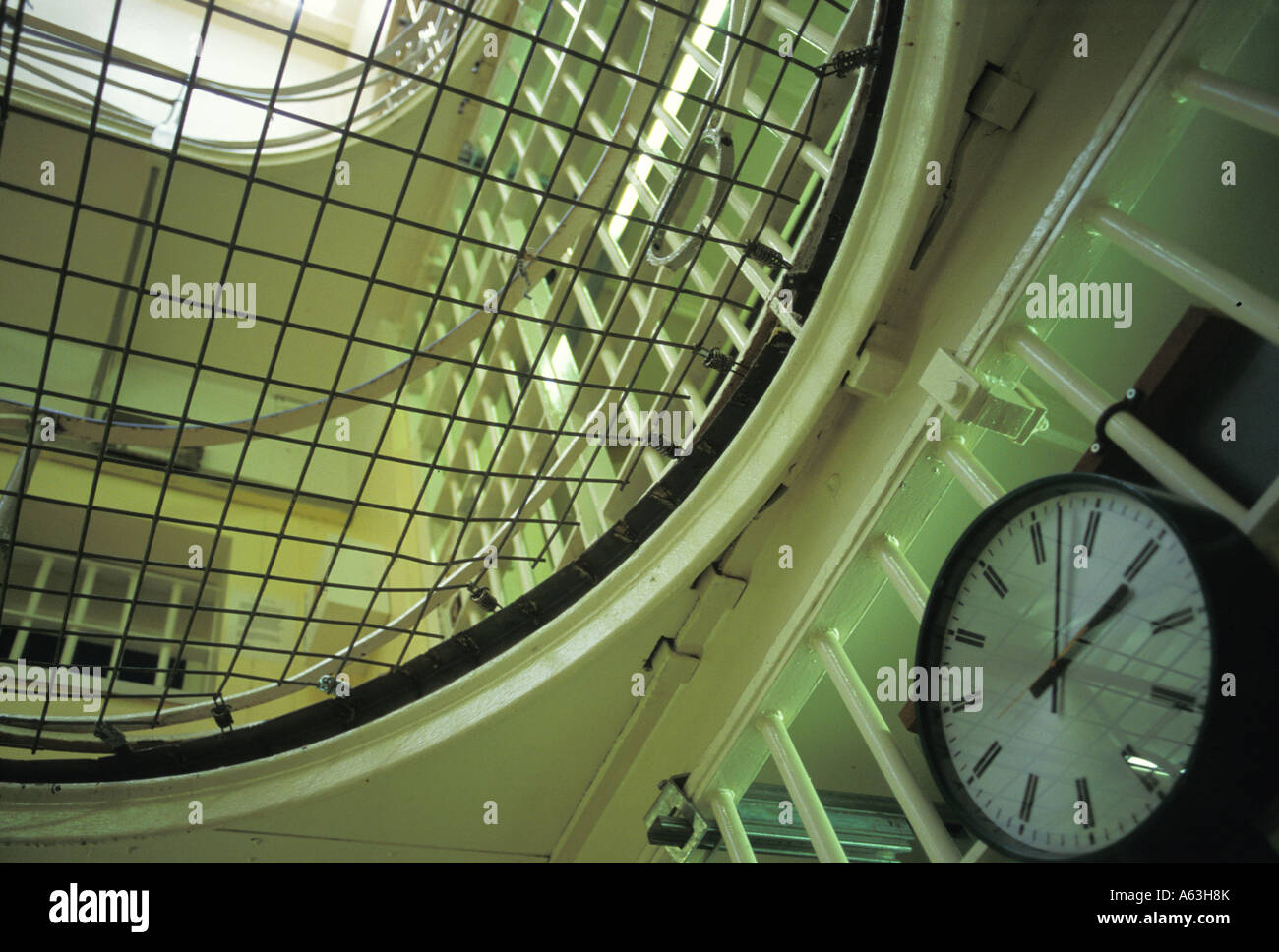 Doing time (Looking up at a clock at the end of a landing) at HM Prison ...