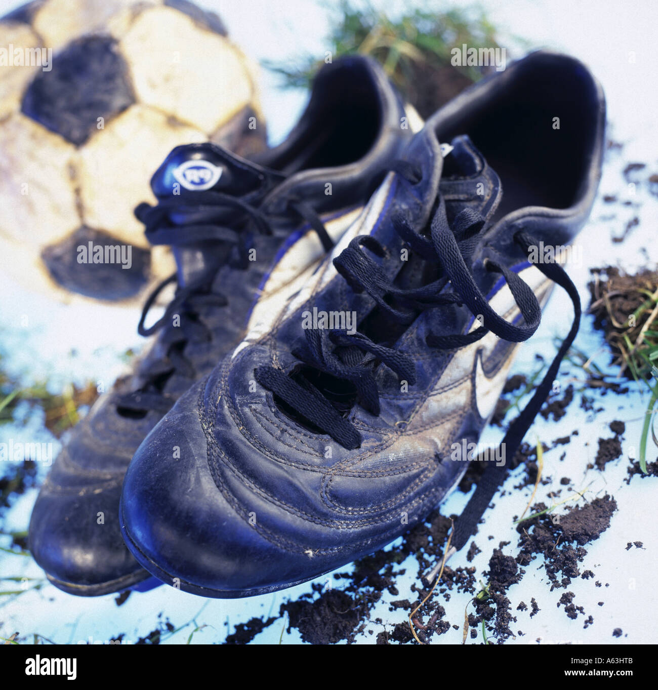 Close-up of pair of soccer shoes and ball Stock Photo - Alamy