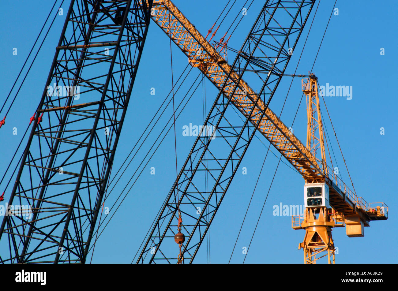 cranes construction equipment uplifting height tall towering big Stock ...