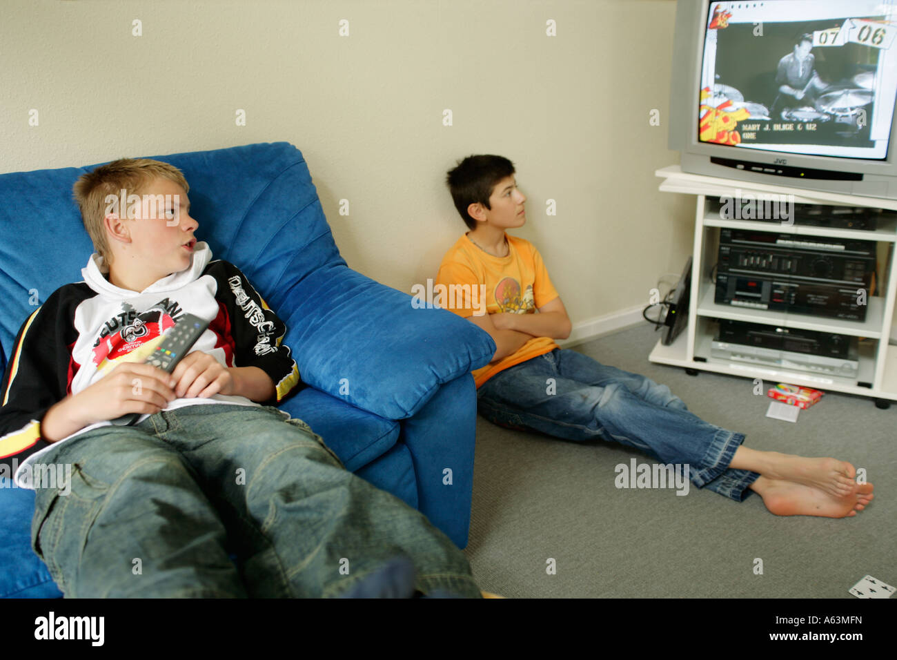 portrait of two young boys glued to the television Stock Photo - Alamy