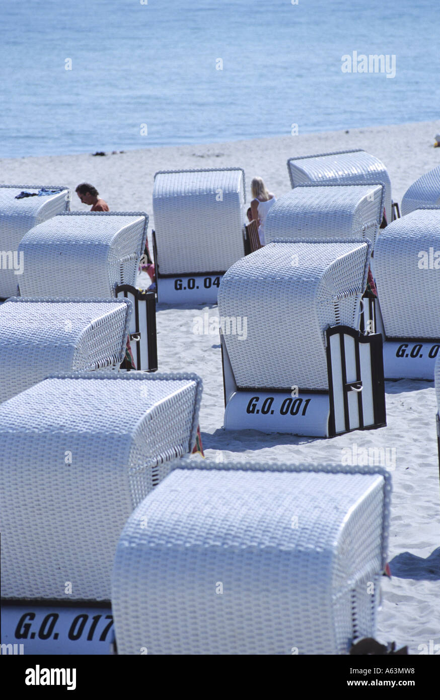 Roofed wicker beach chairs on beach, Germany Stock Photo - Alamy