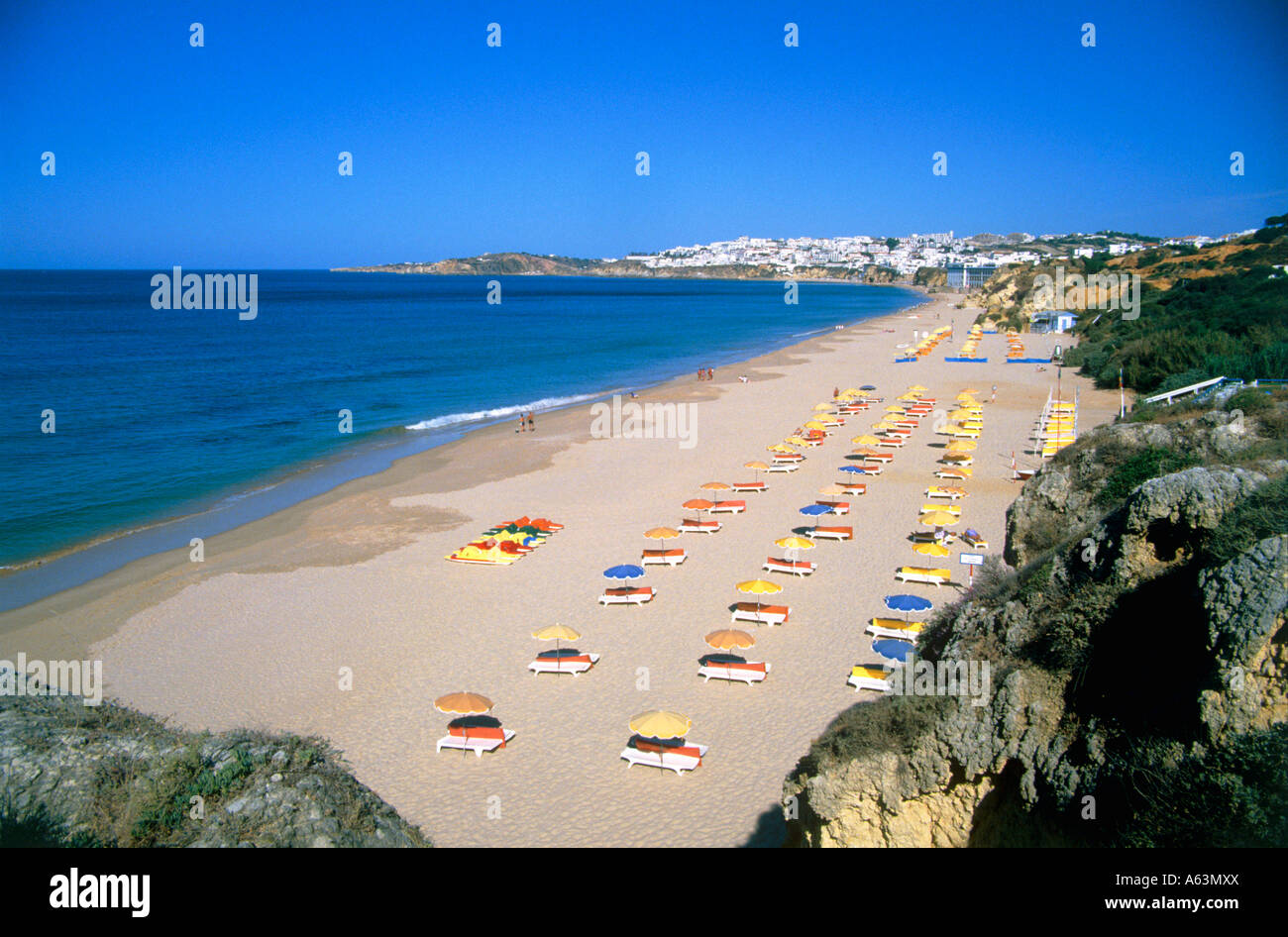 beach scene at morning near resort of albufeira region of algarve ...