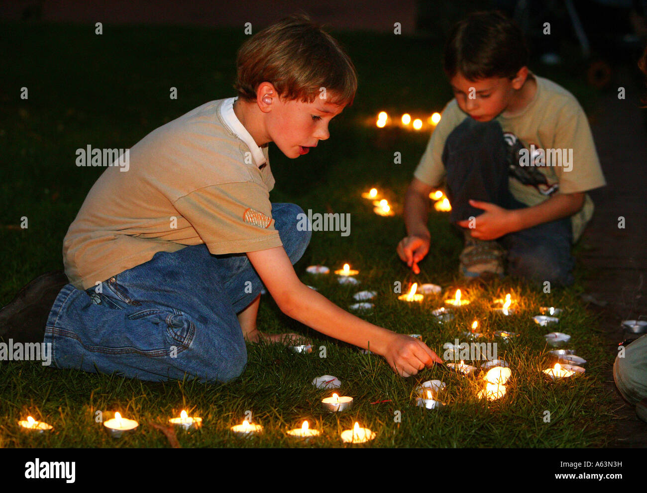 Boys lightens candles during the annual light celebration festival in ...