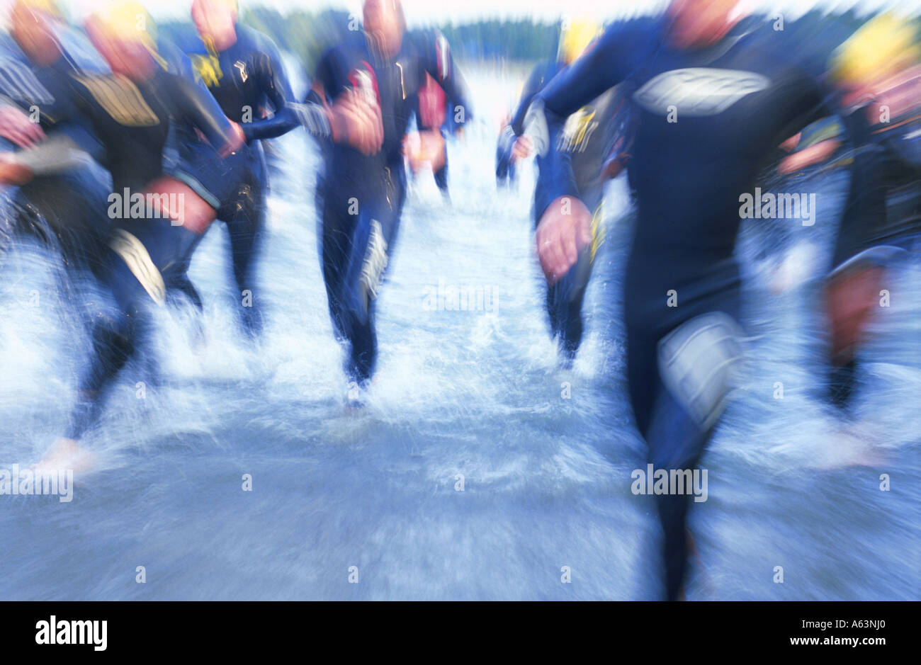 Men running in water Stock Photo - Alamy