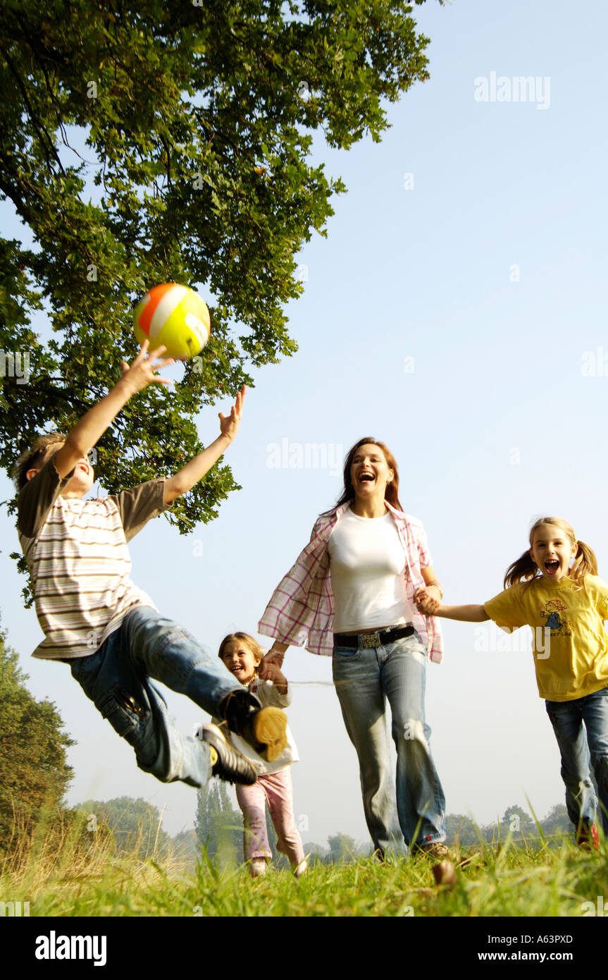 Children playing ball in park hi-res stock photography and images - Alamy
