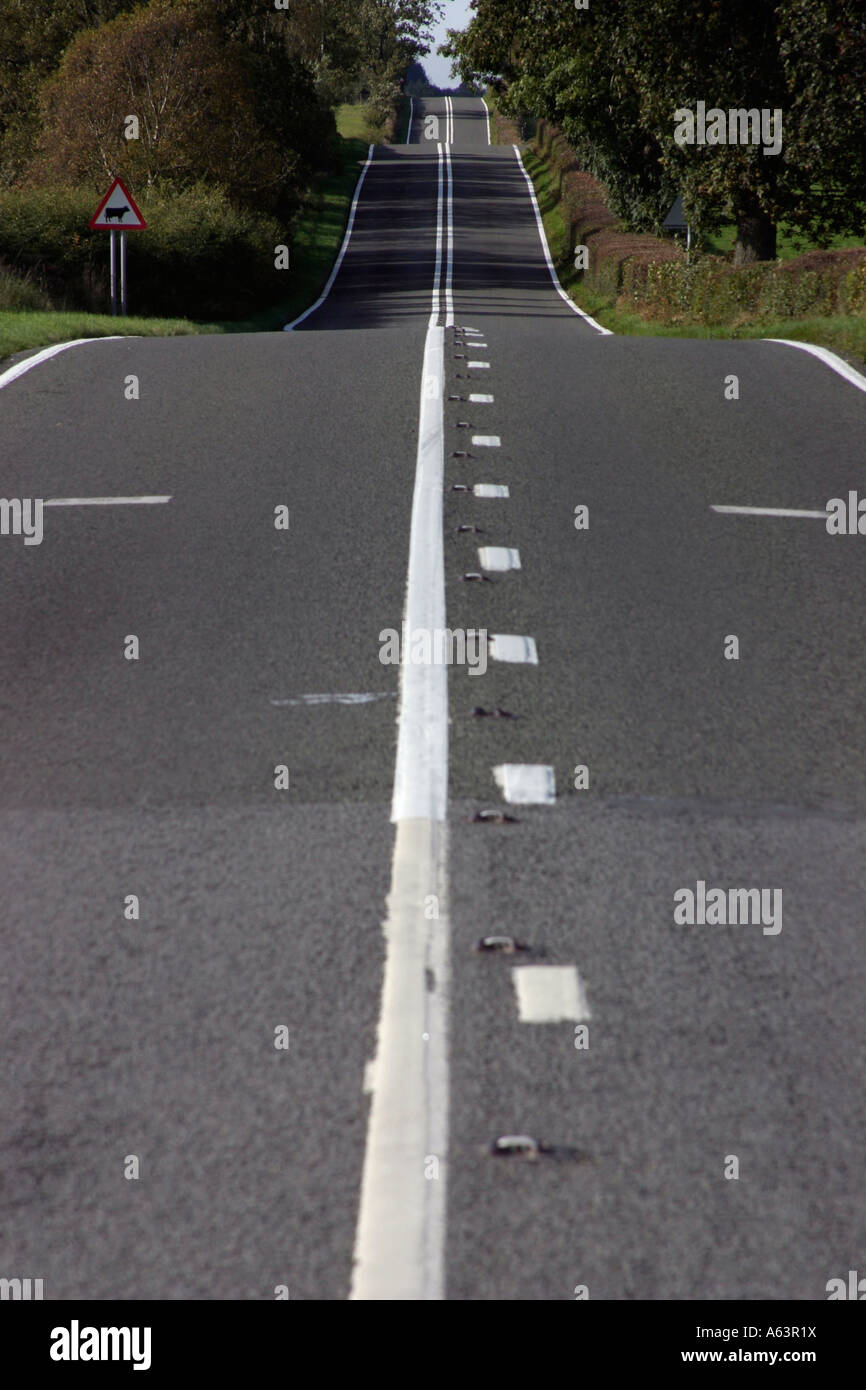 long straight undulating road in Wales UK Stock Photo - Alamy