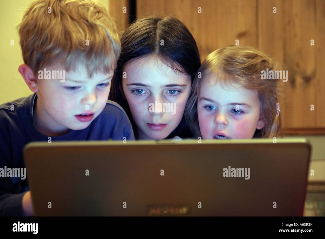 Family with three children at home hi-res stock photography and images ...