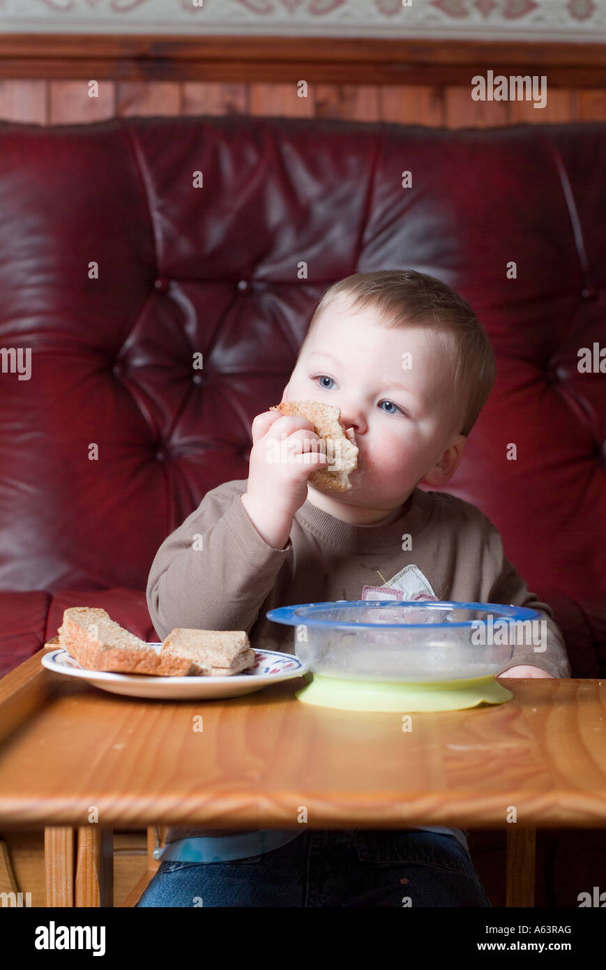 2 year old boy eating at home Stock Photo - Alamy