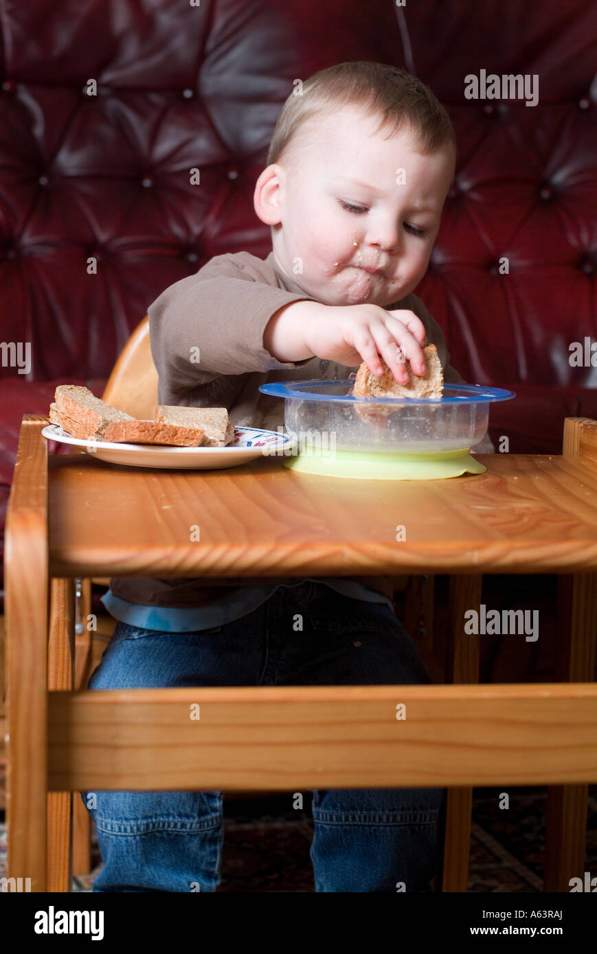 2 year old boy eating at home Stock Photo - Alamy