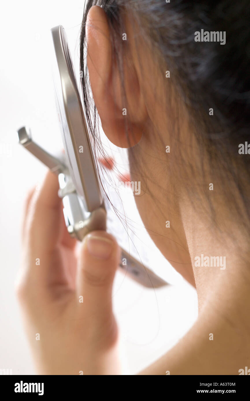 Back of woman’s head on cell phone Stock Photo - Alamy