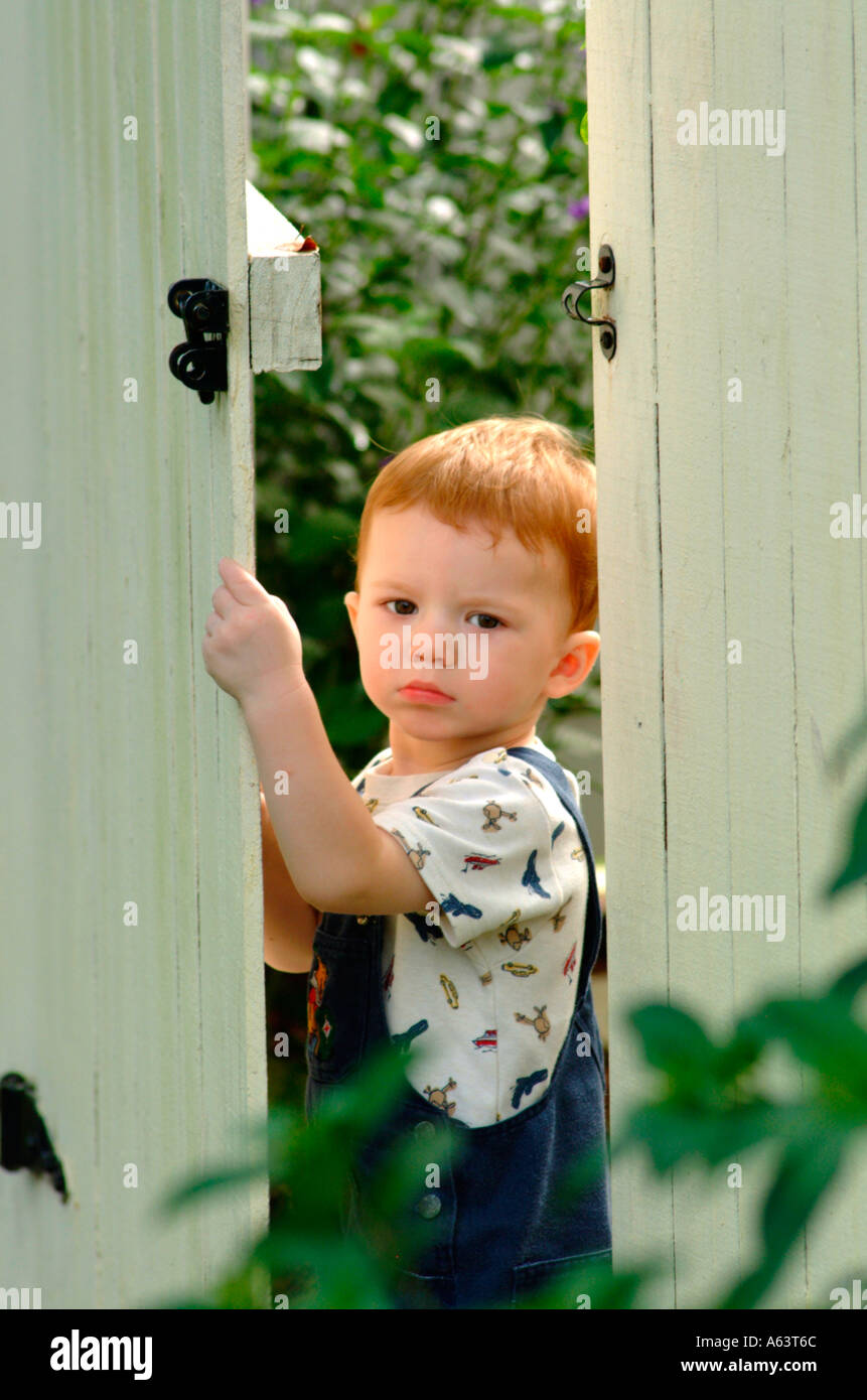 Toddler opening gate hi-res stock photography and images - Alamy