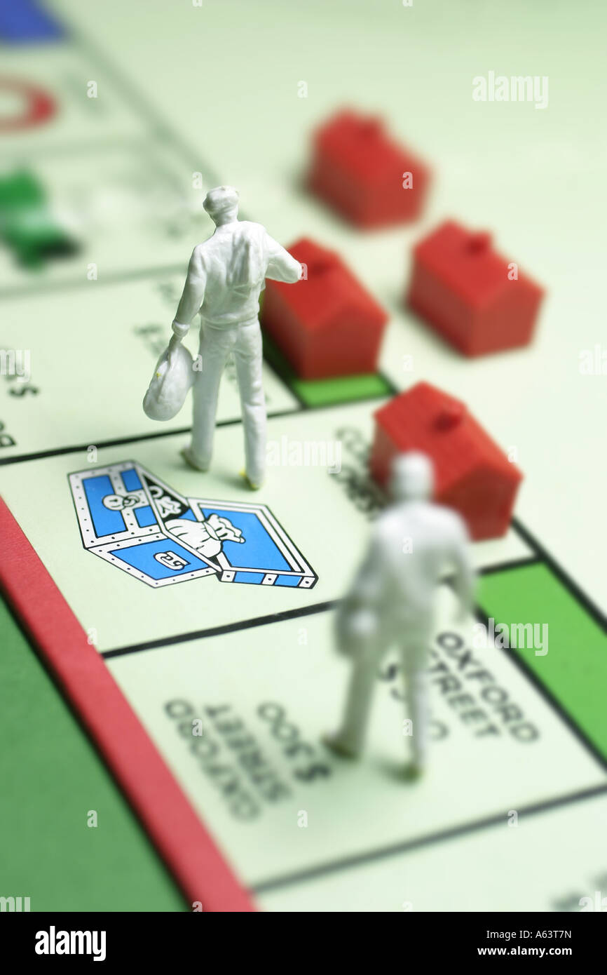 Miniature Figures and Houses on Monopoly Game Stock Photo - Alamy