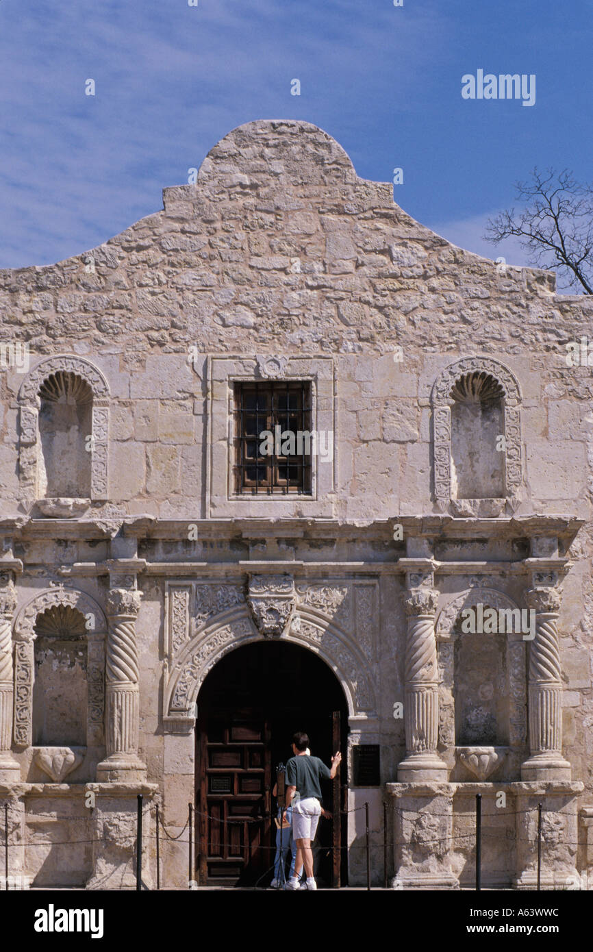 Tourists entering the front door of the historic Alamo San Antonio ...