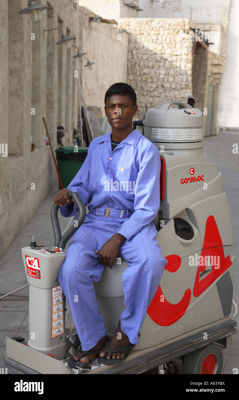 Street Cleaner takes rest in Doha Qatar Stock Photo - Alamy