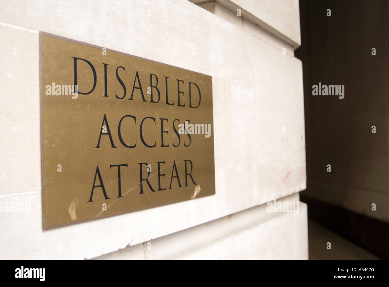 DISABLED ACCESS AT REAR sign England UK Stock Photo - Alamy