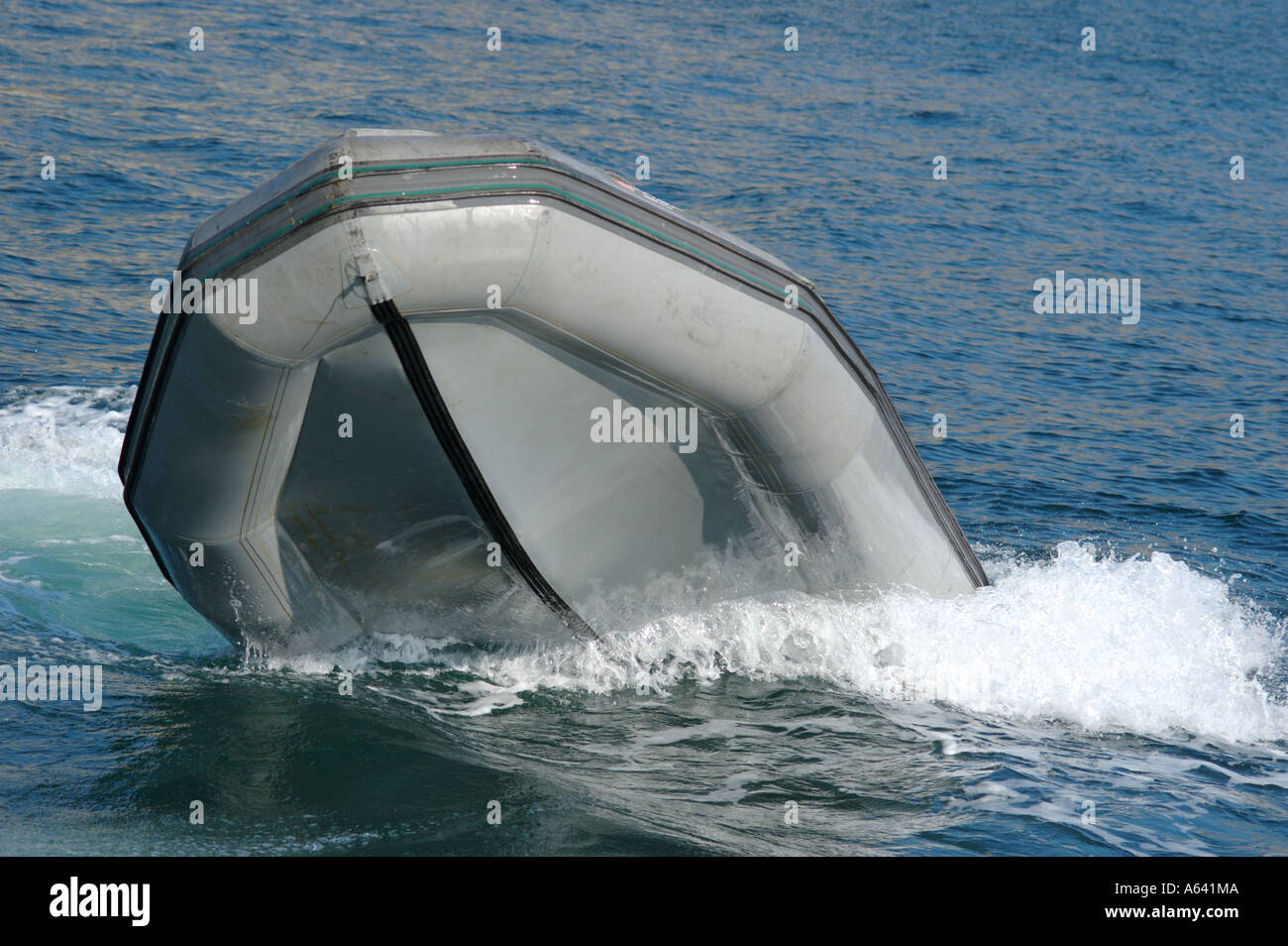 Small rubber boat hydroplaning in ocean Stock Photo - Alamy