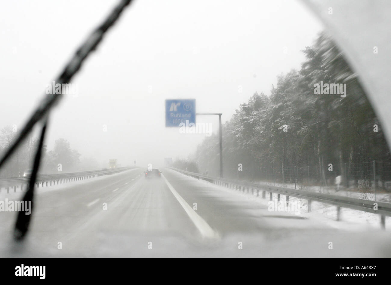 Snowfall and poor visibility on a german Autobahn in winter Stock Photo ...