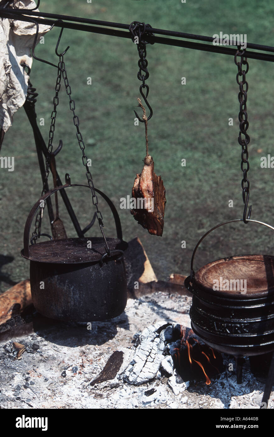 meat caldron and pot cooking on campfire Stock Photo - Alamy