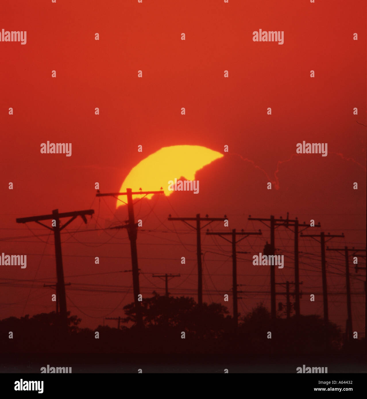 huge sunset and telephone and power line poles Stock Photo - Alamy
