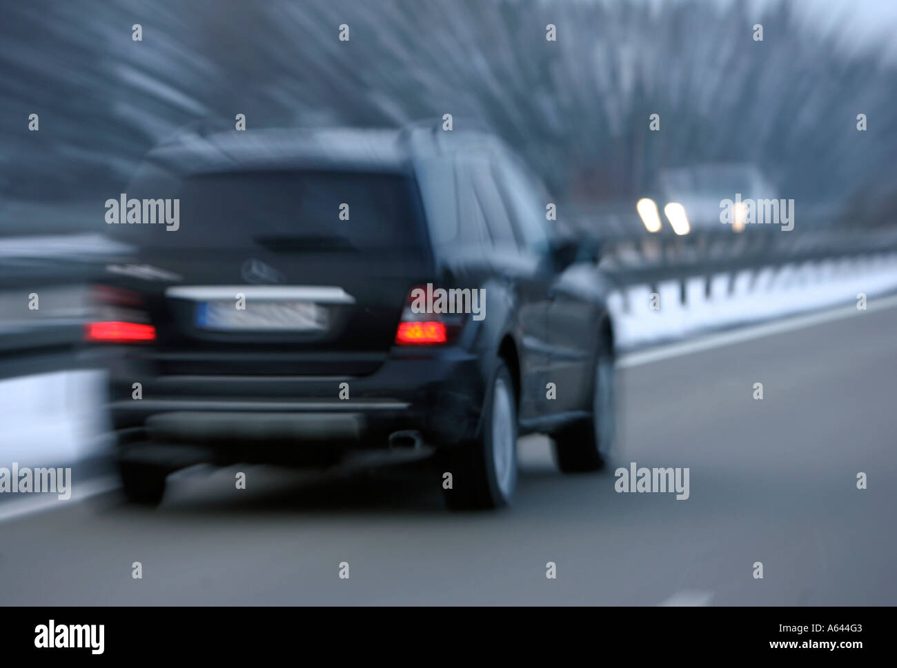 Mercedes M drives very fast on a german Autobahn Stock Photo - Alamy