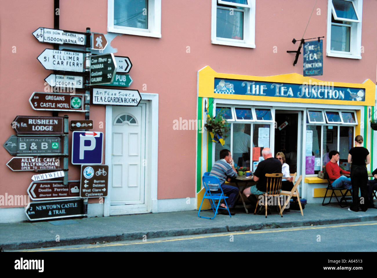 A busy signpost next to a quiet tea cafe in Ballyvaughan County Clare ...