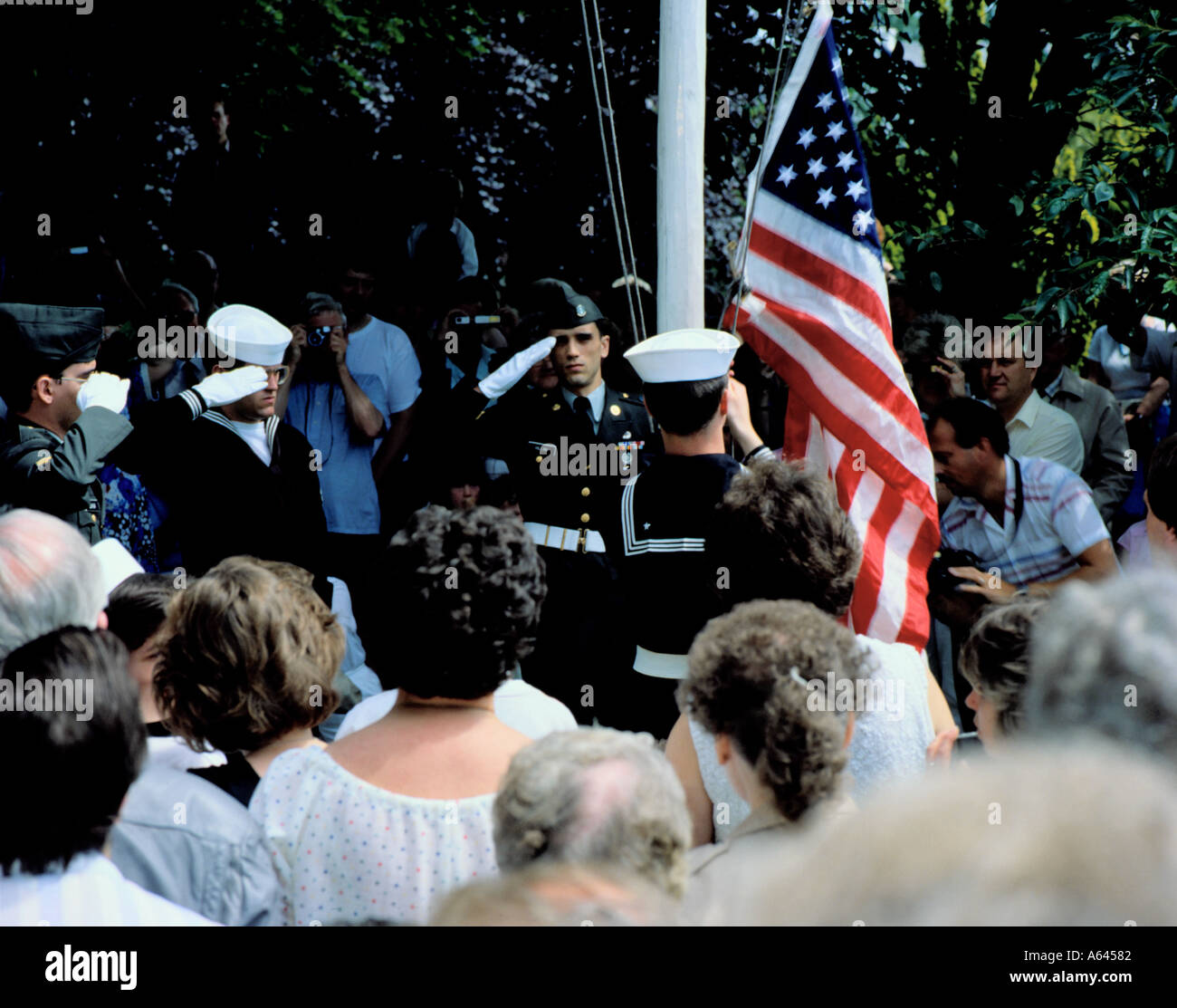 Hoisting american flag hi-res stock photography and images - Alamy