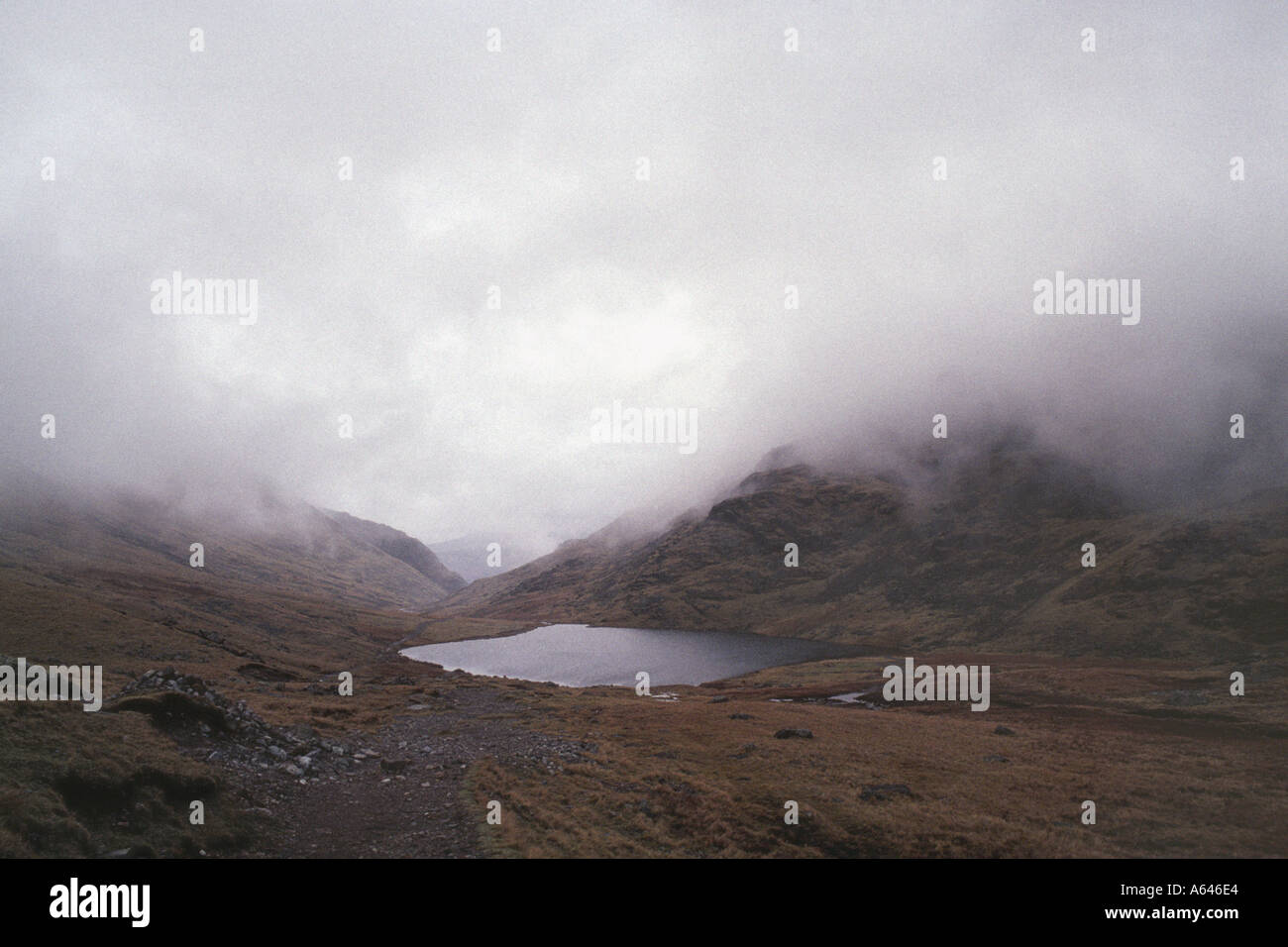 Styhead Tarn in mist Lake District England Stock Photo - Alamy