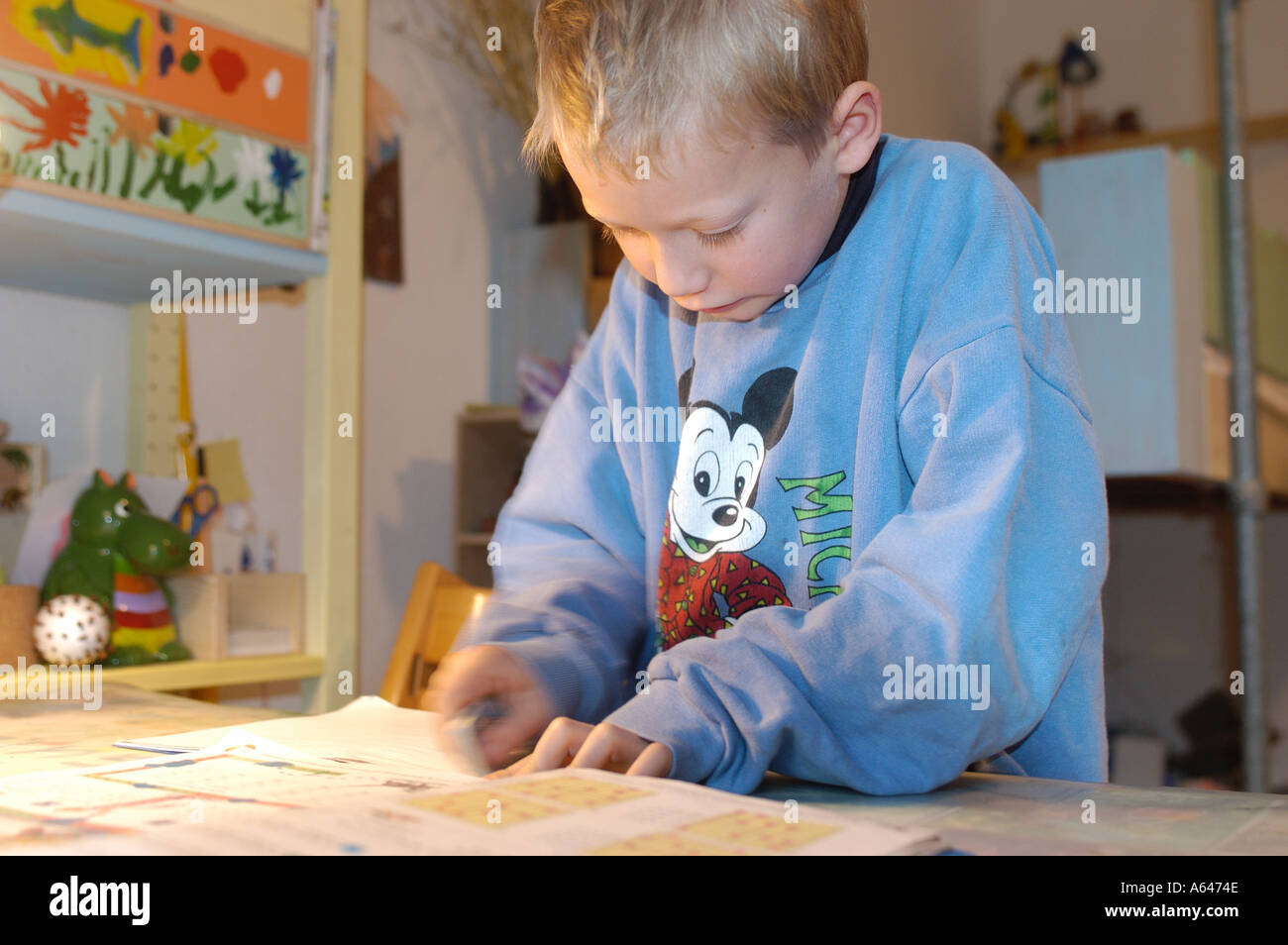 Little boy doing his homework Stock Photo - Alamy
