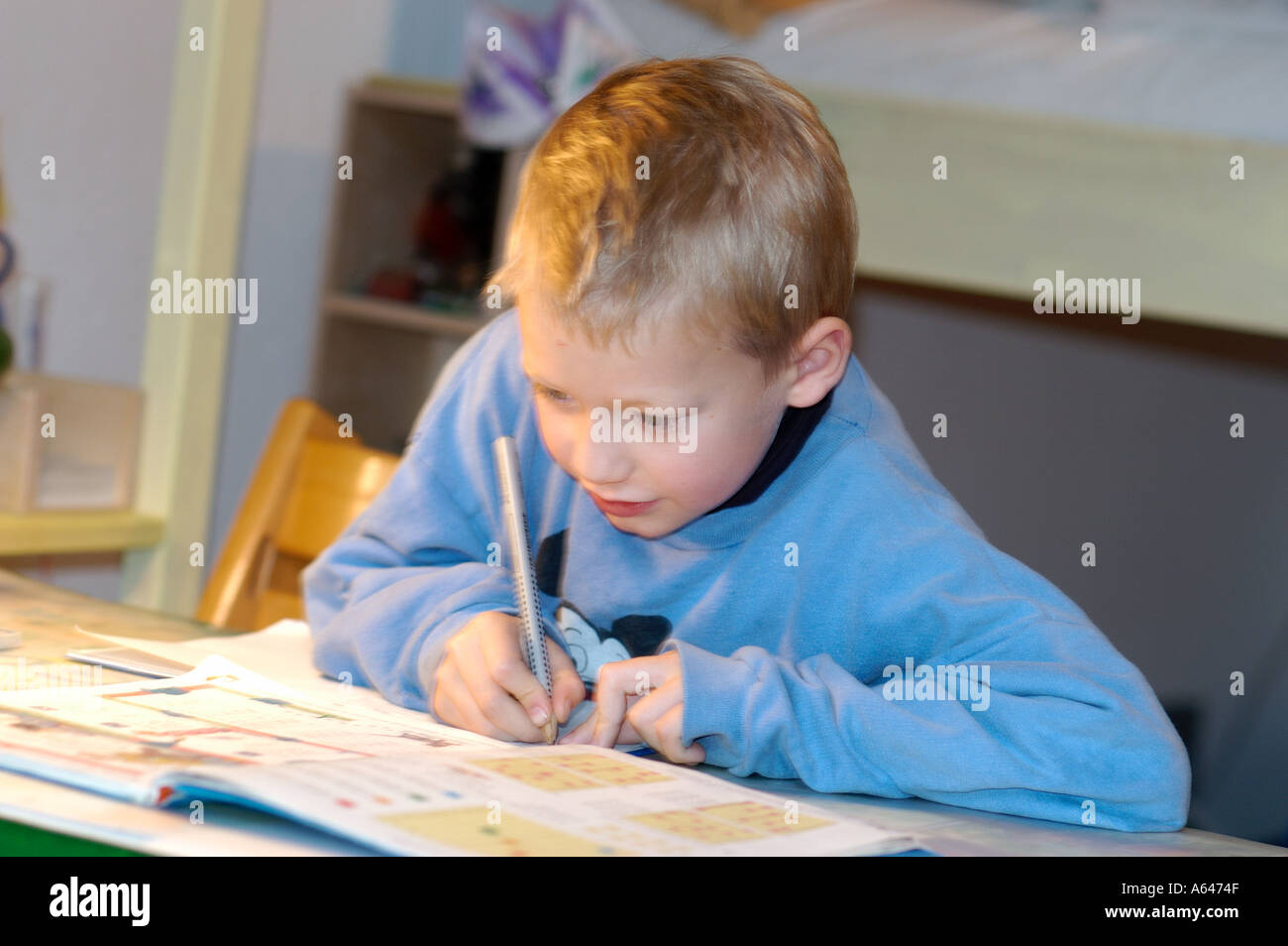 Little boy doing his homework Stock Photo - Alamy